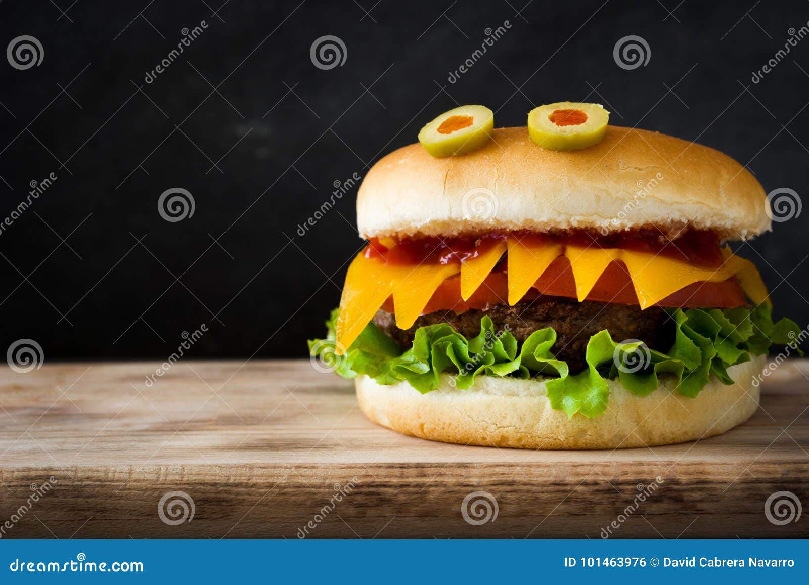 Halloween Burger Monsters on Wooden Table. Stock Photo - Image of food ...