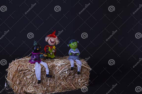 Halloween Characters Sitting on a Haystack - Fun Times Stock Image ...