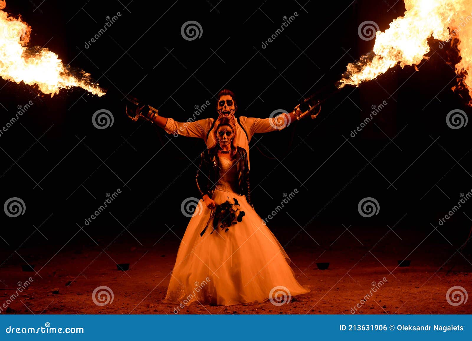 Halloween Couple Standing with Flamethrower. Big Fire Stock Photo ...