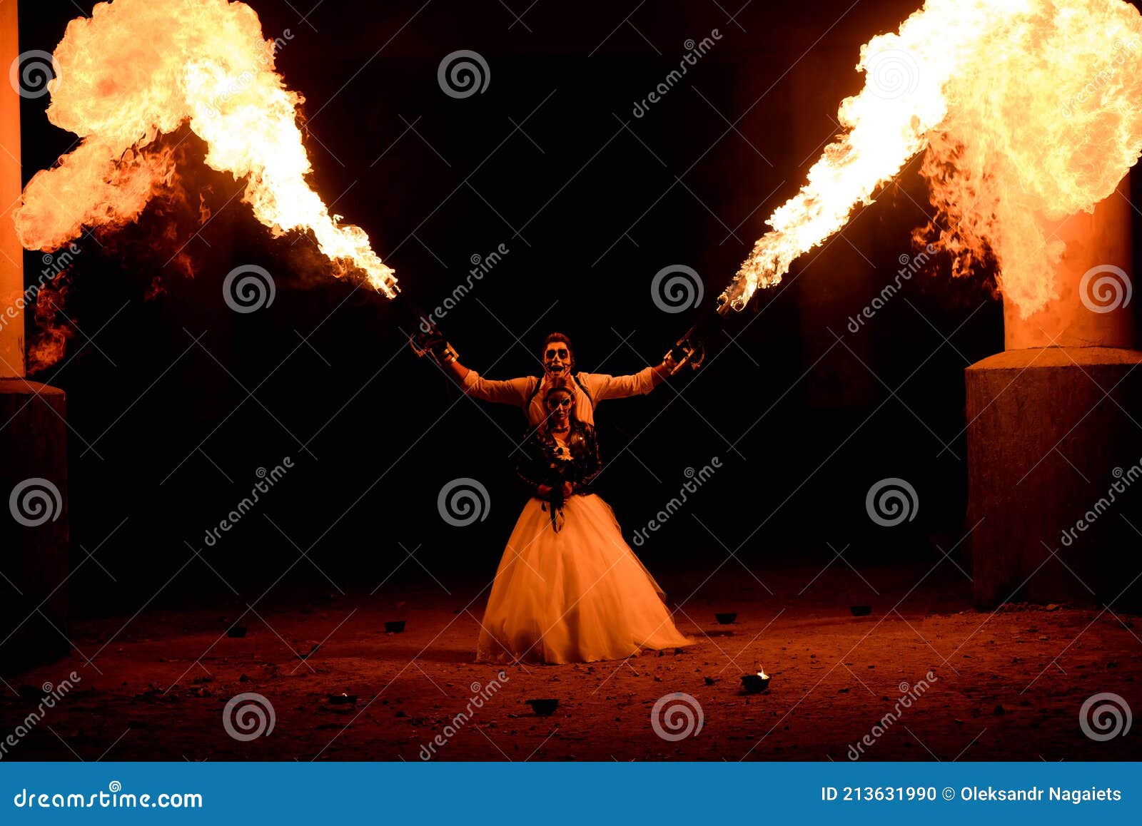 Halloween Couple Standing with Flamethrower in Hands. Big Fire Stock ...