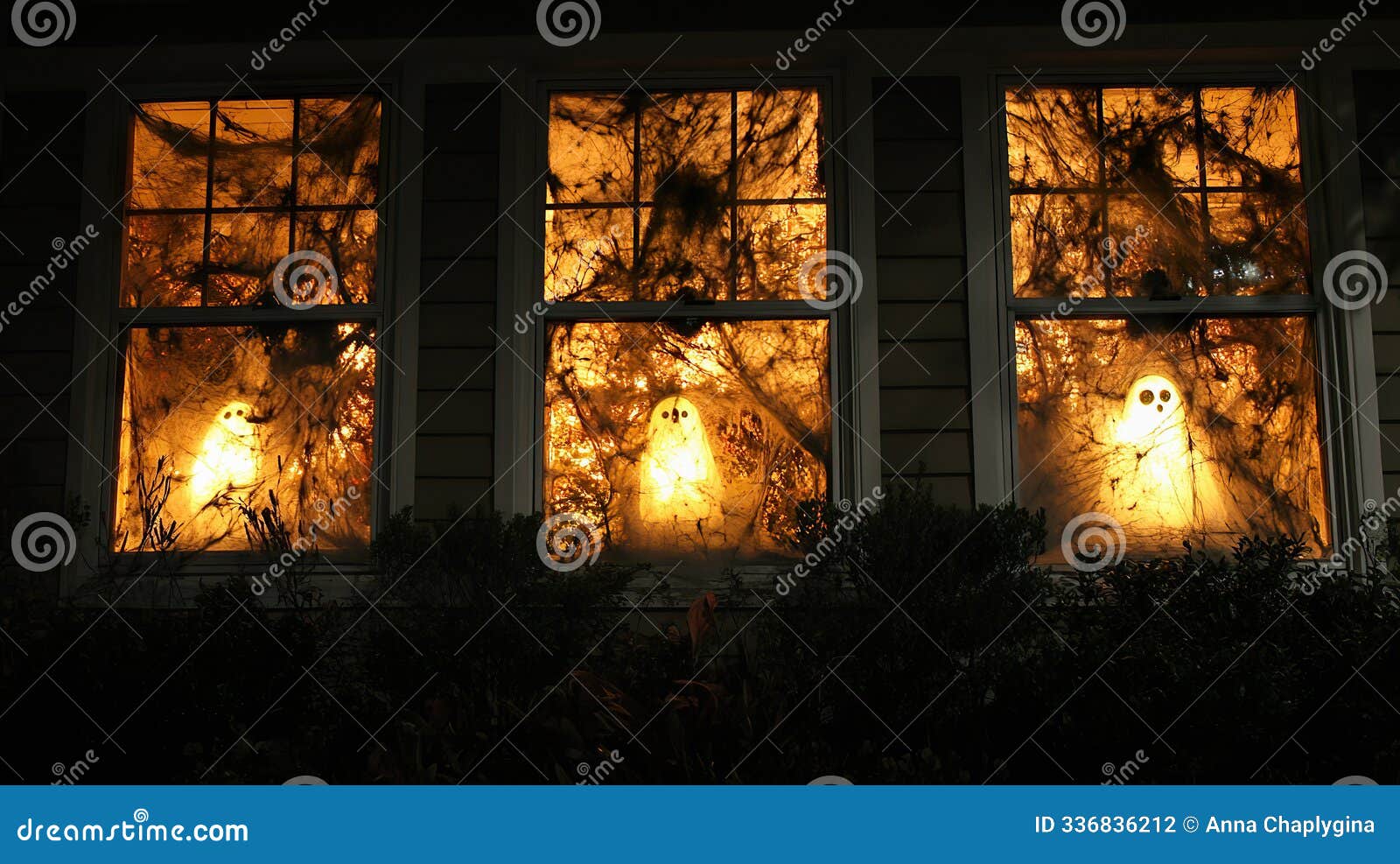 Halloween Decorations in Spooky Windows with Ghostly Figures and ...