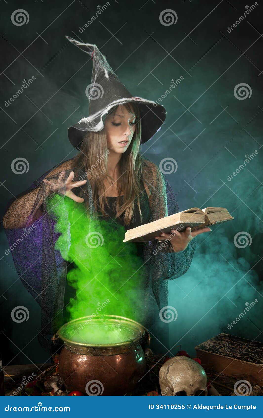 Halloween Witch Cooking a Potion in a Cauldron Stock Photo - Image of ...