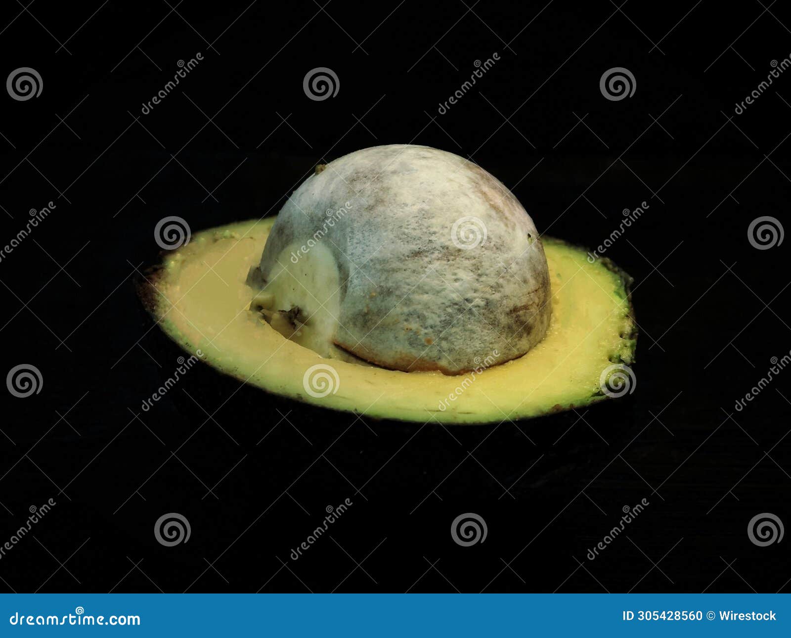Halved Avocado with Pit on Dark Background Stock Photo - Image of seed ...
