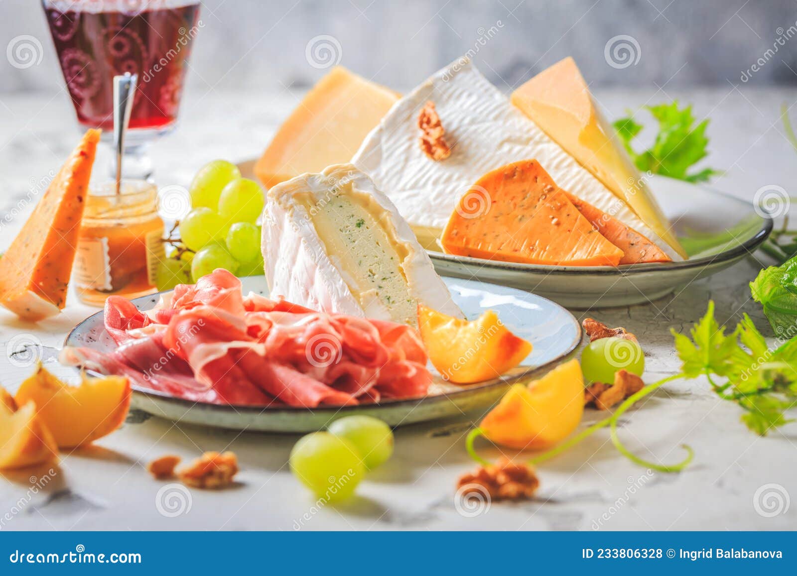 Ham and Cheese Platter with Grapes, Nuts and Red Wine Stock Photo ...