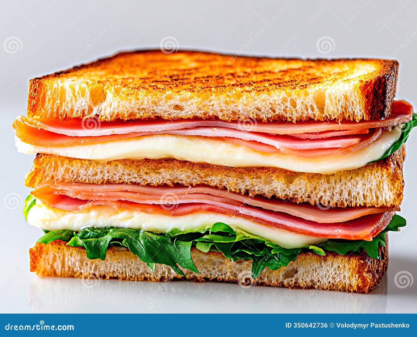 A Ham and Cheese Sandwich Cut in Half on a White Surface Stock Photo ...