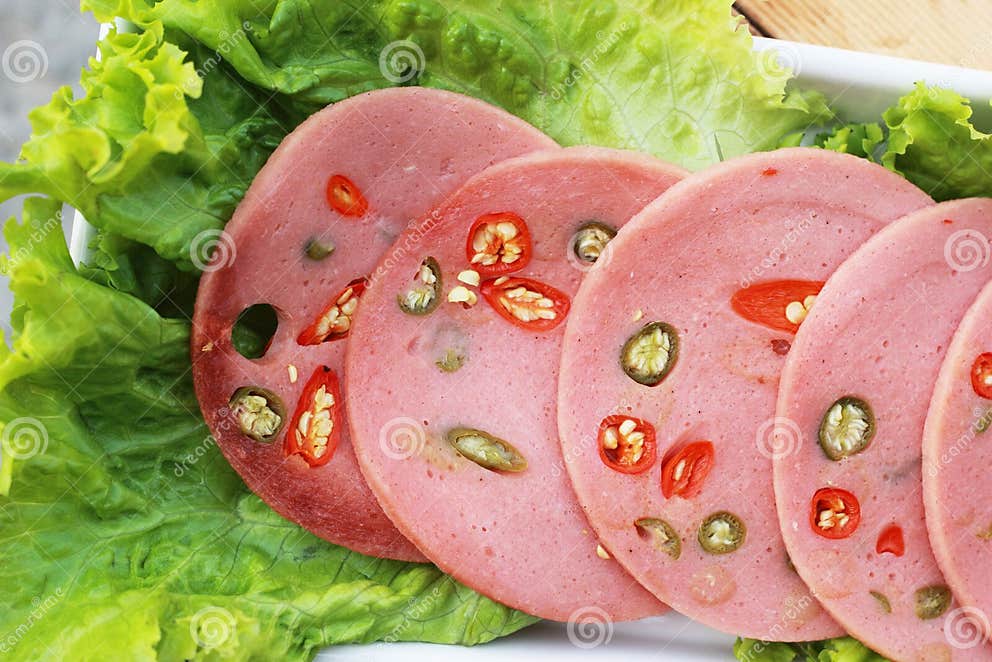 Ham Cut into Circular Discs with Red Peppers. Stock Photo - Image of ...
