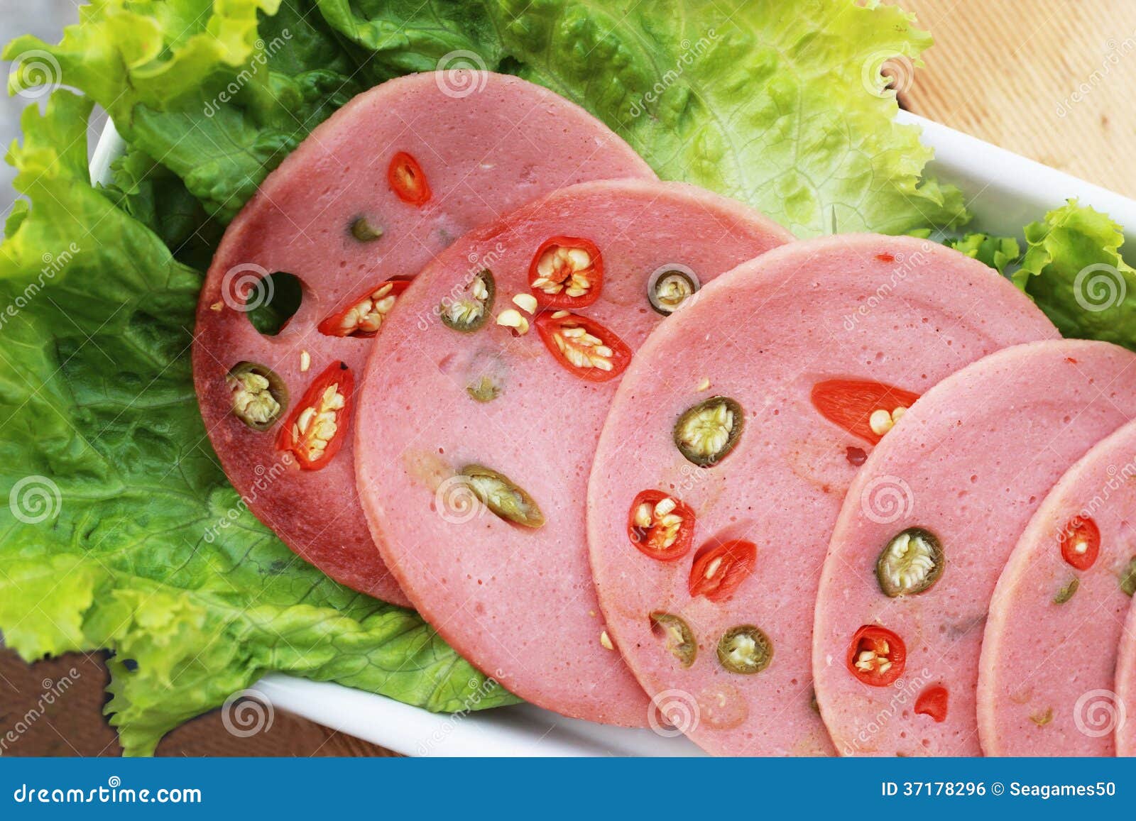 Ham Cut into Circular Discs with Red Peppers. Stock Photo - Image of ...