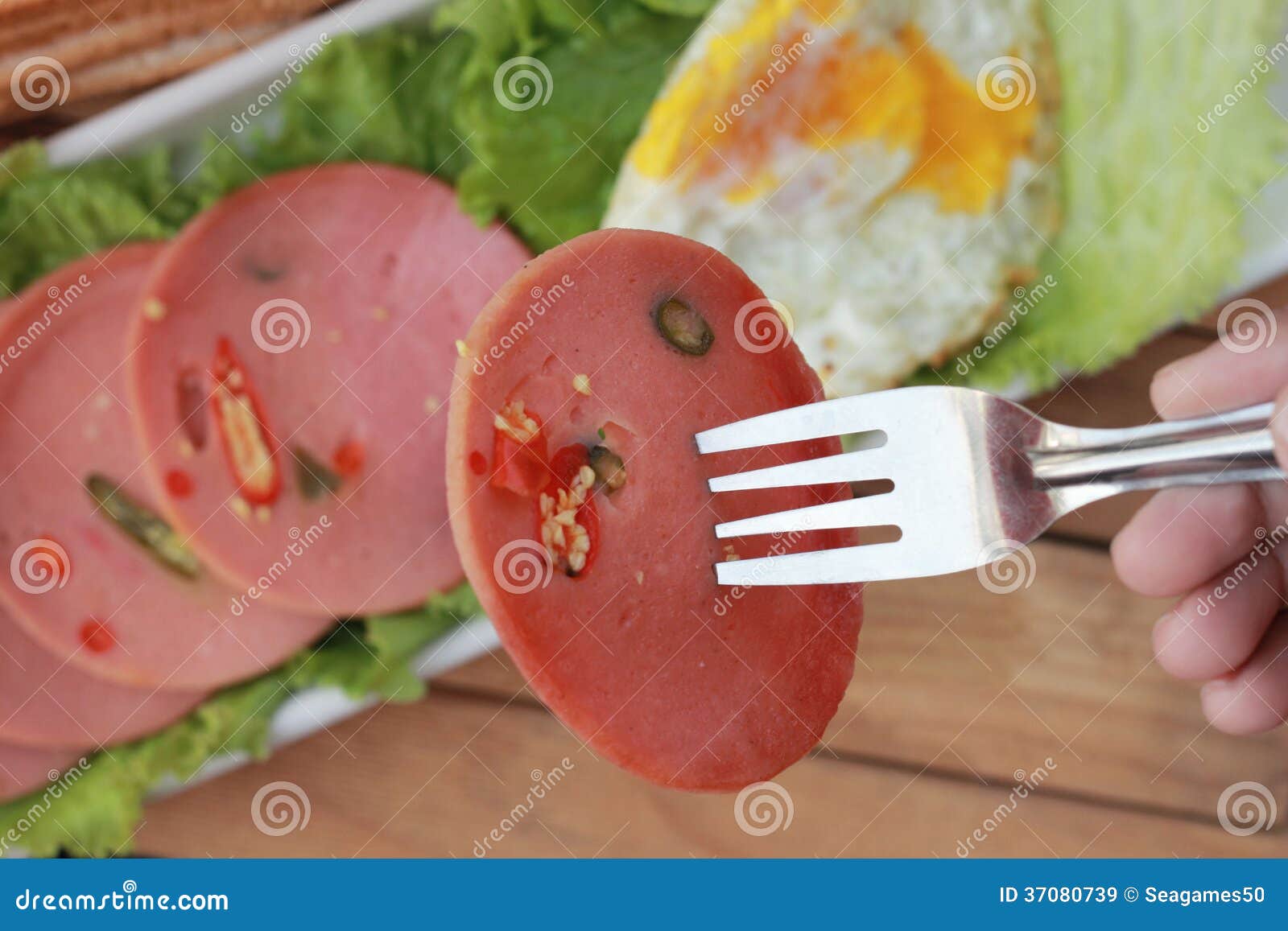 Ham Cut into Circular Discs with Red Peppers and Egg Fried. Stock Image ...