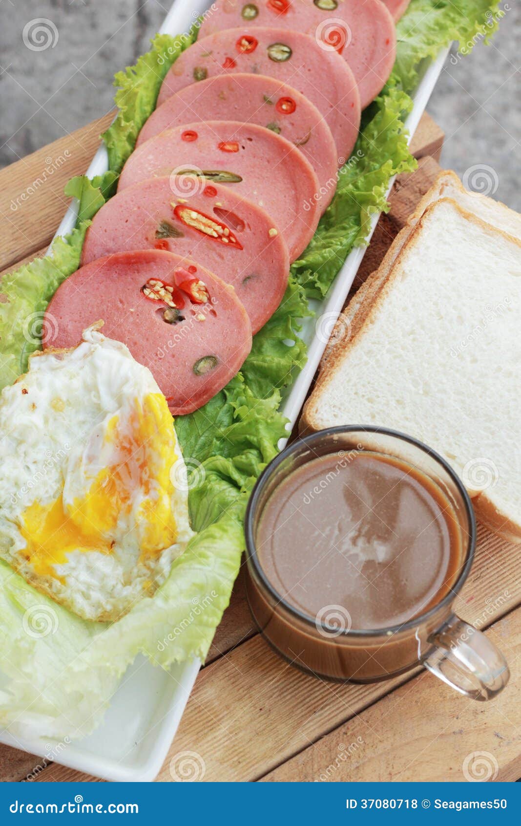Ham Cut into Circular Discs with Red Peppers and Hot Coffee Stock Photo ...