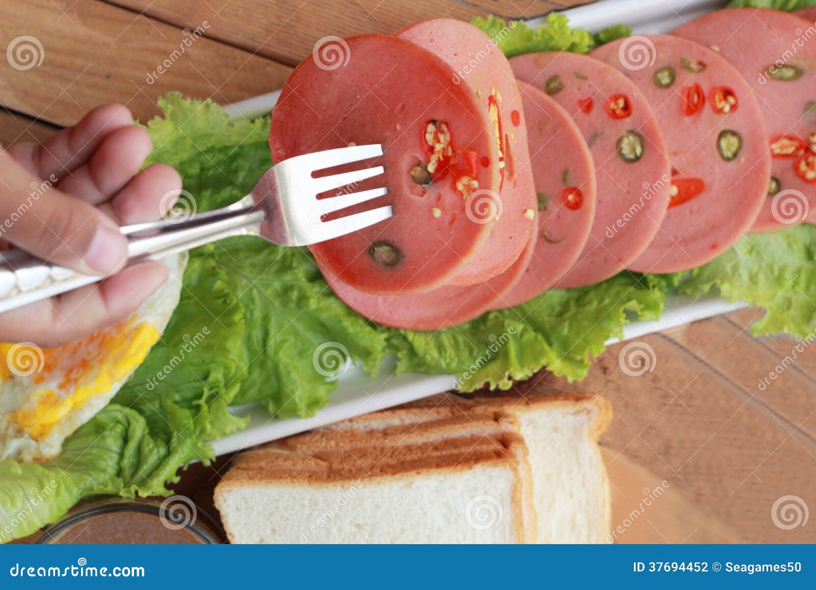 Ham Cut into Circular Discs with Red Peppers and Hot Coffee Stock Photo ...