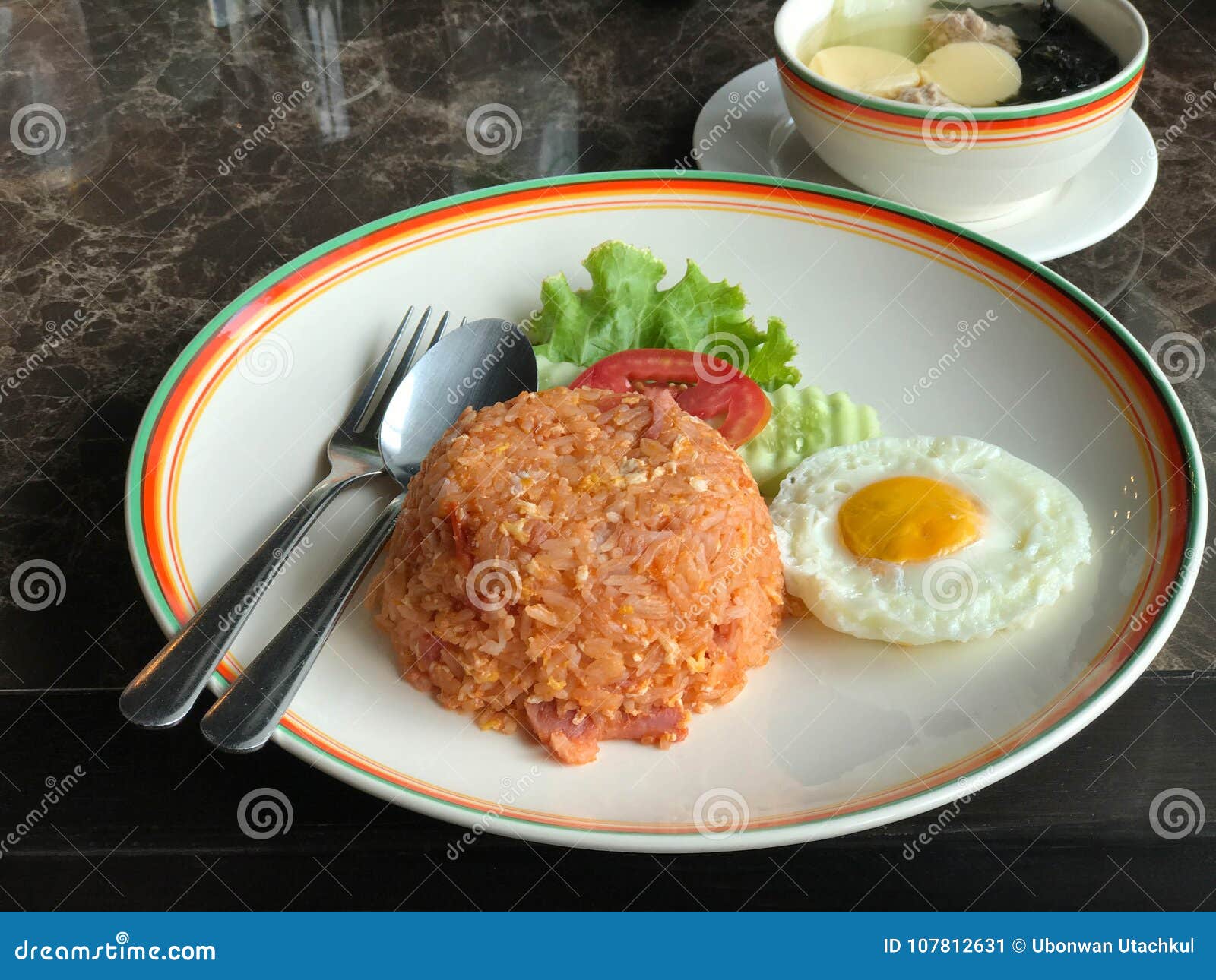 Ham and Egg Fried Rice in Plate with Fried Egg and Soup Stock Image ...