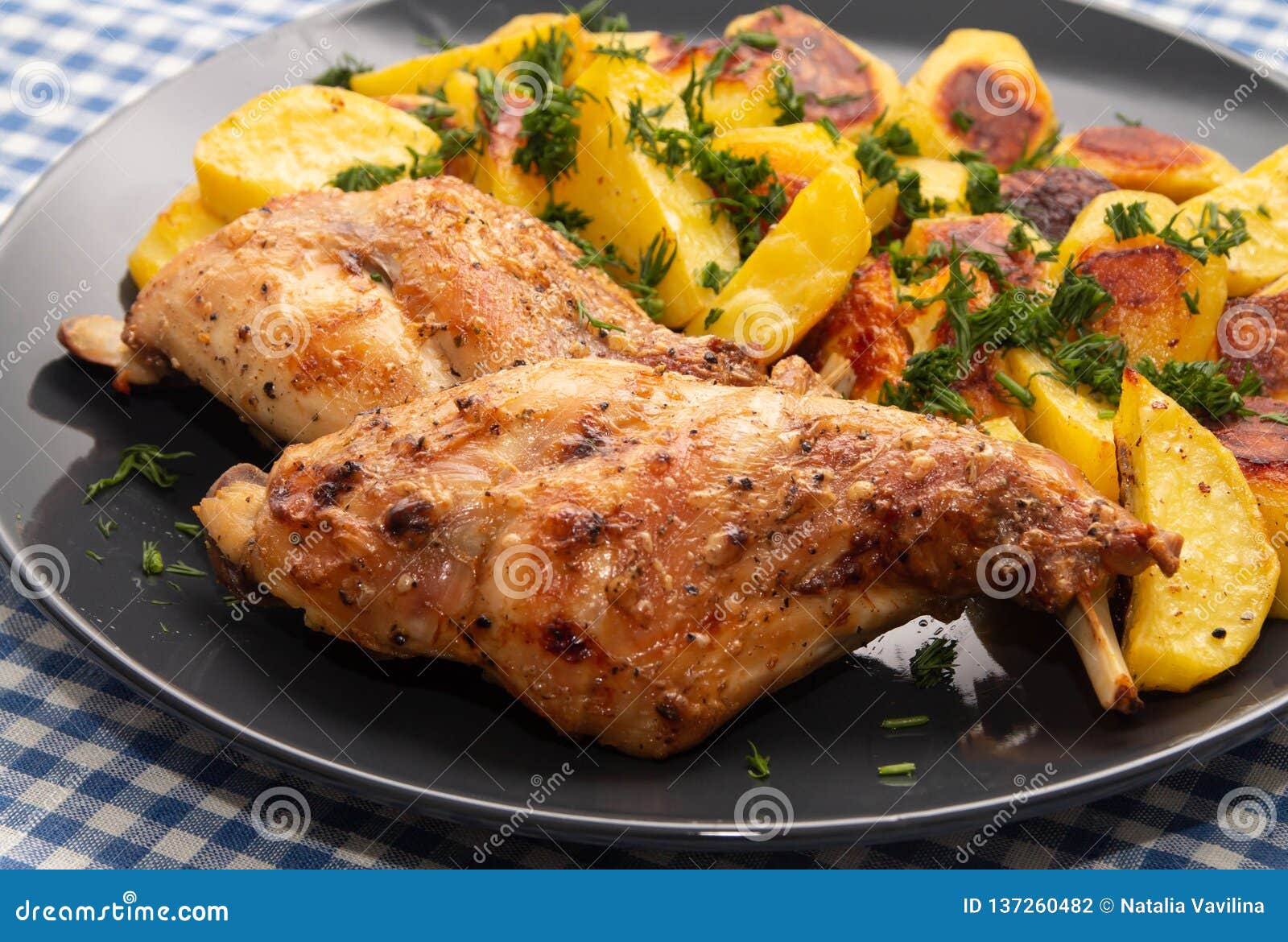 Ham Rabbit with Potatoes Cooked in the Oven Lies on a Plate Stock Photo ...