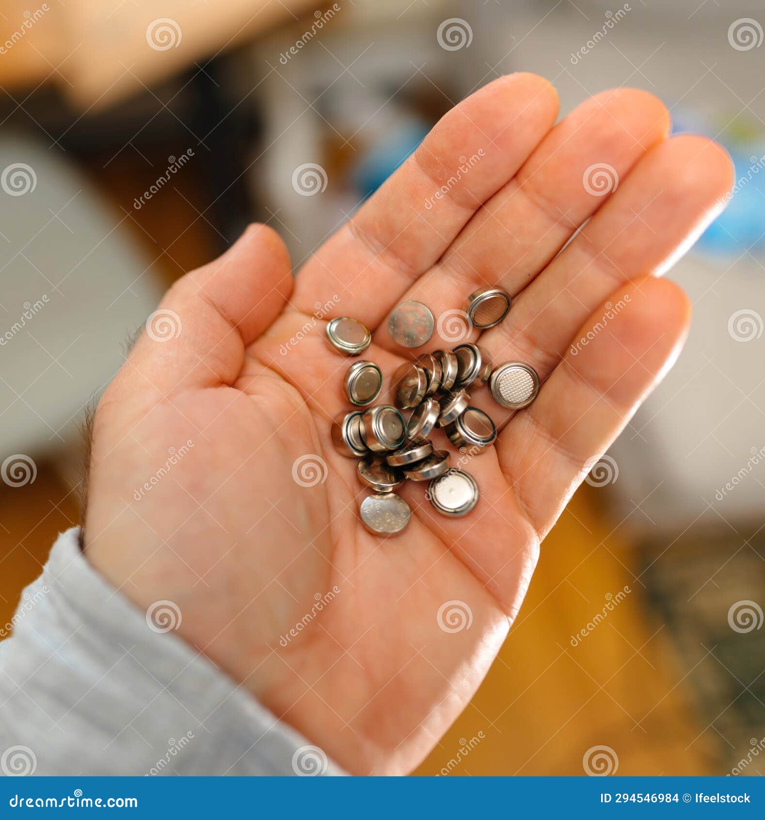 Hand Holding Assorted Button Batteries Stock Photo - Image of hand ...
