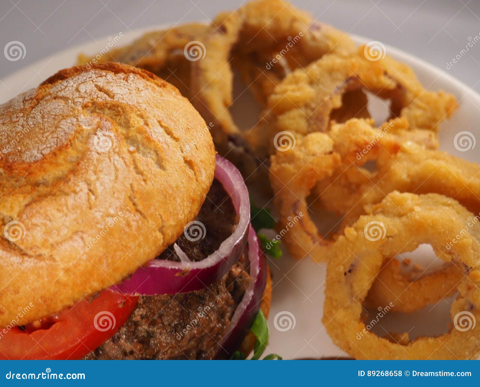 Hamburger and onion rings stock photo. Image of cheddar - 89268658