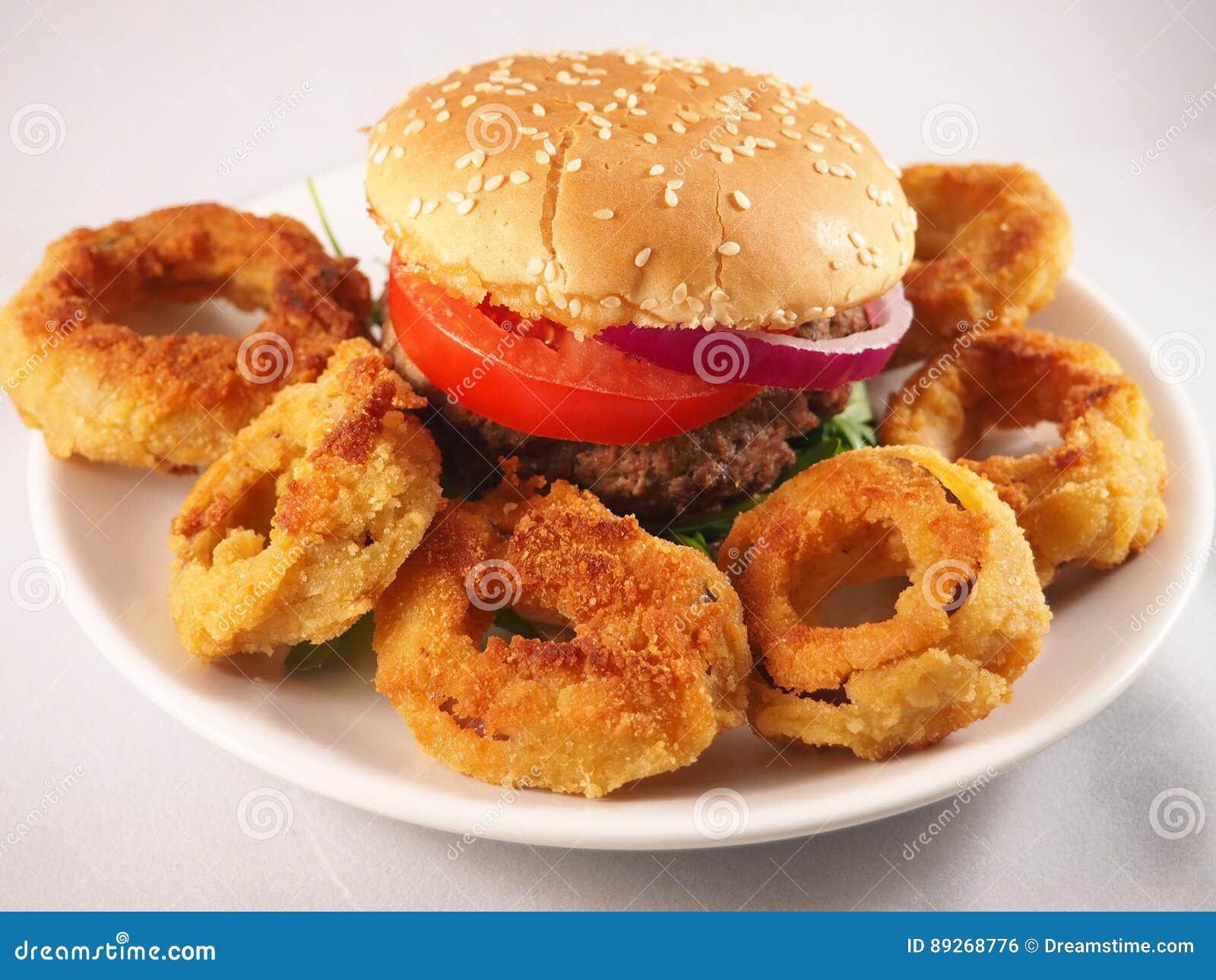 Hamburger and onion rings stock photo. Image of cheese - 89268776