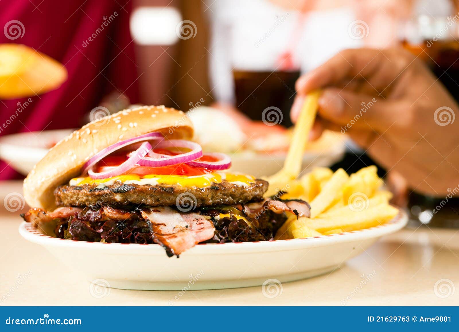 Hamburger in a restaurant stock image. Image of food - 21629763