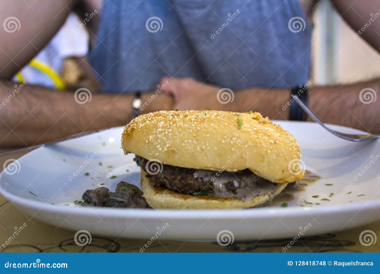 Hamburger on a plate stock photo. Image of greens, greasy - 128418748