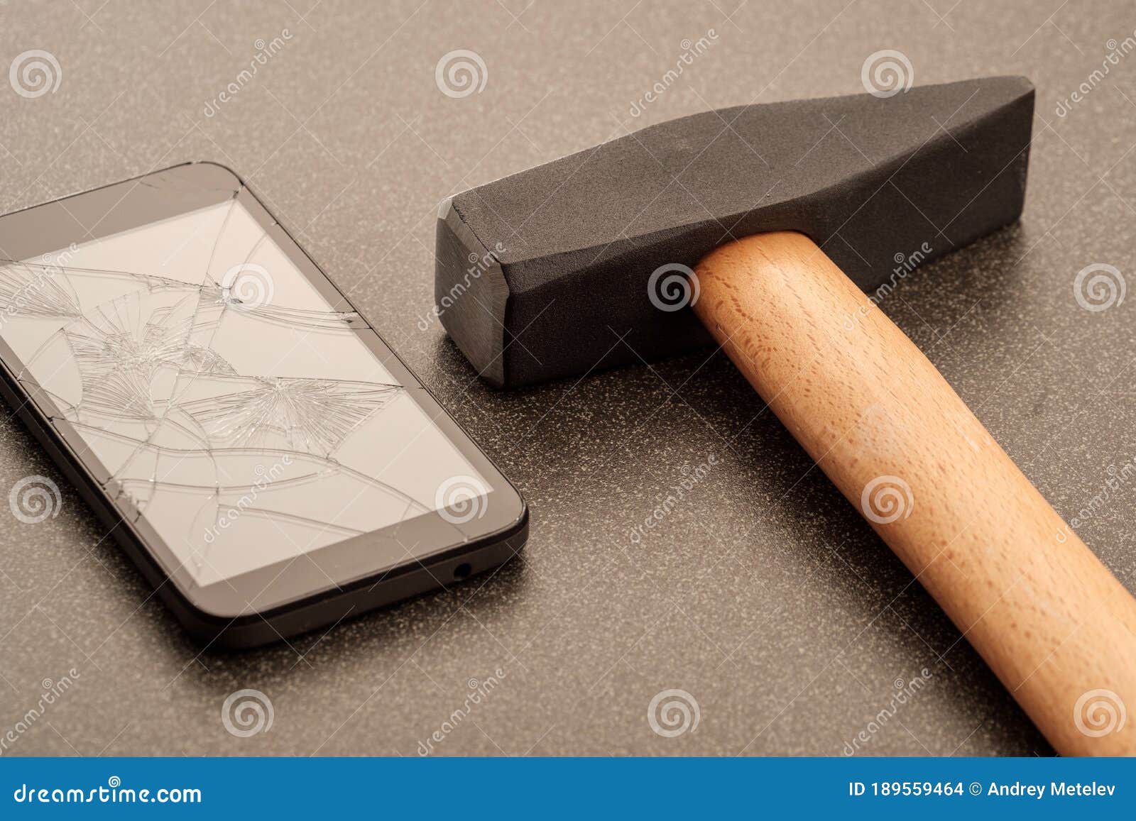 Hammer Breaking a Smartphone Screen on a Ceramic Surface Stock Photo ...