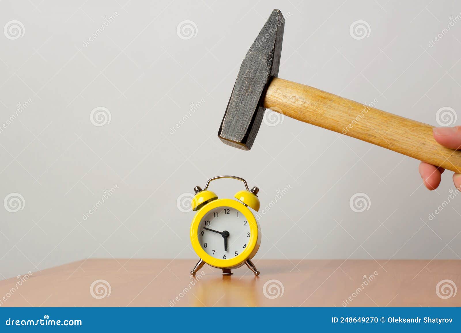 The Hammer Breaks the Alarm Clock. Tap the Hammer on the Alarm Clock ...