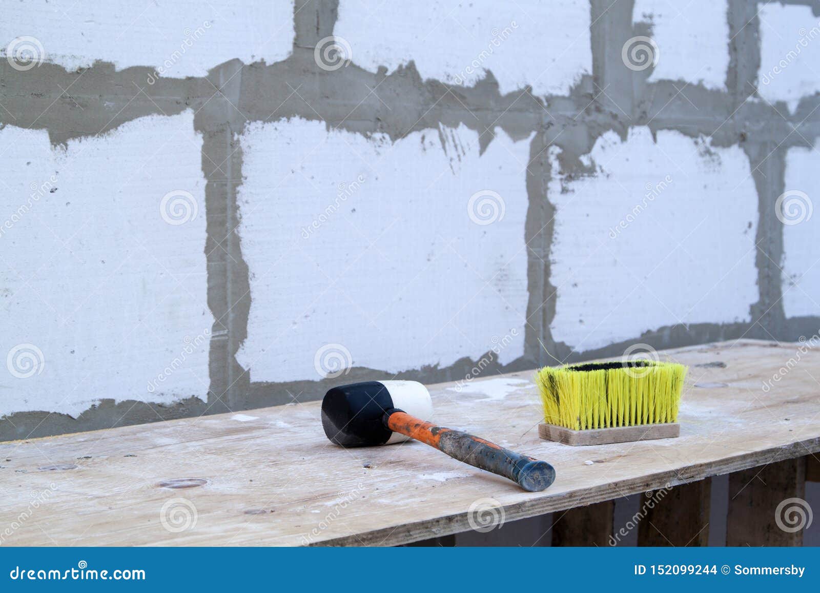 Hammer and Brush are on the Foam Blocks on the Construction of a Stock ...