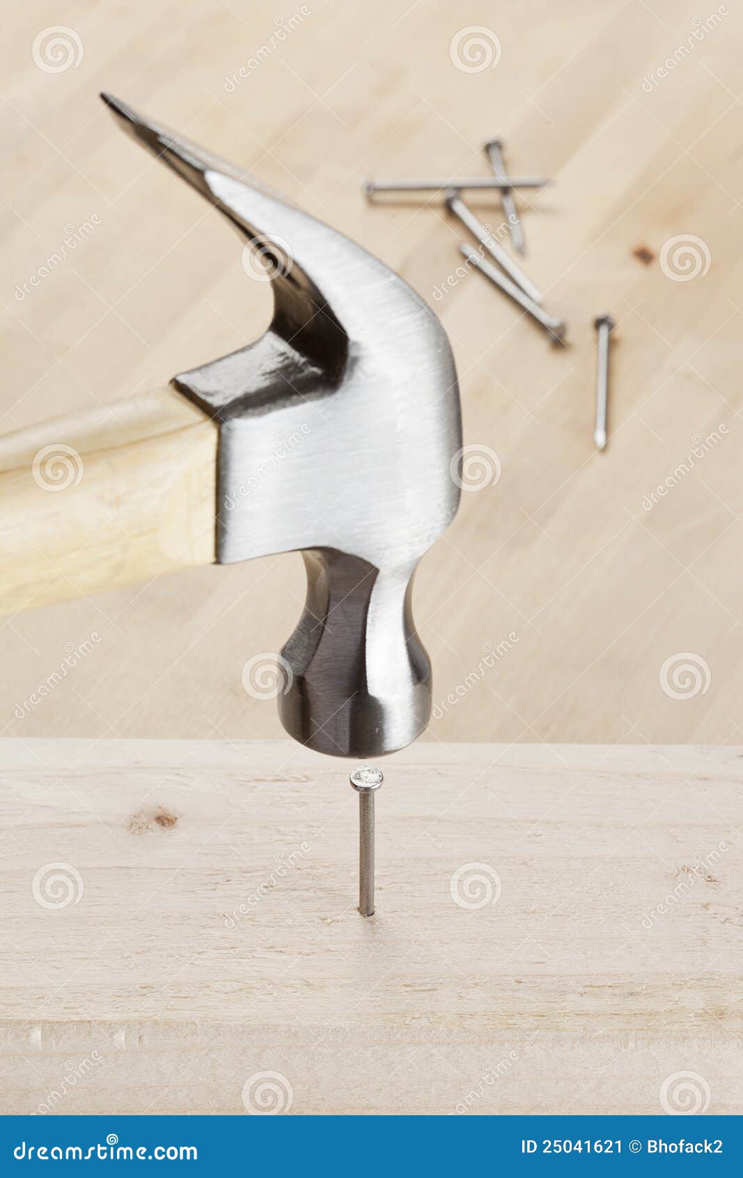 Hammer hitting a nail stock image. Image of construct - 25041621