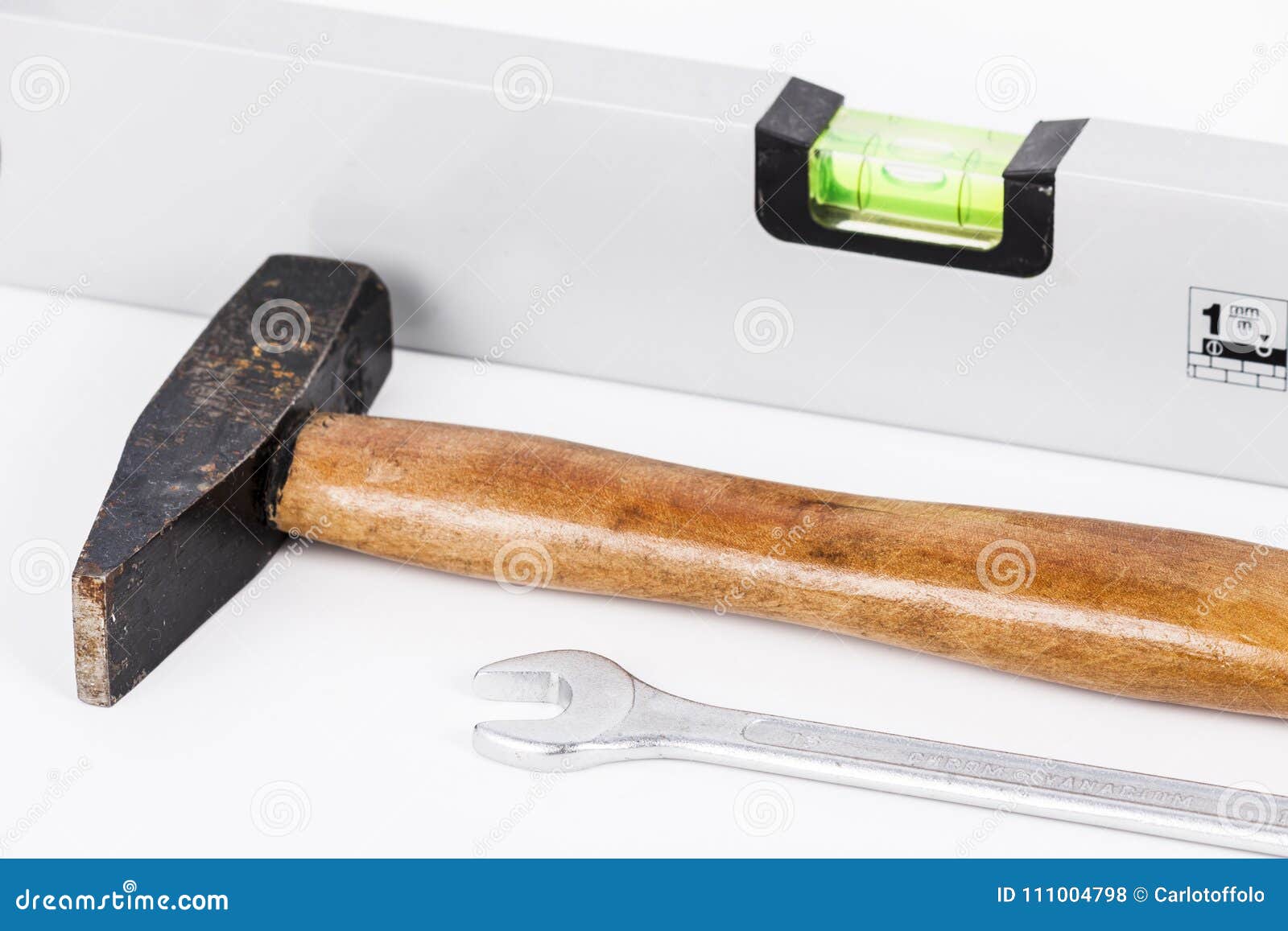 Hammer, Level And T Square Ruler On Timber Background Royalty-Free ...