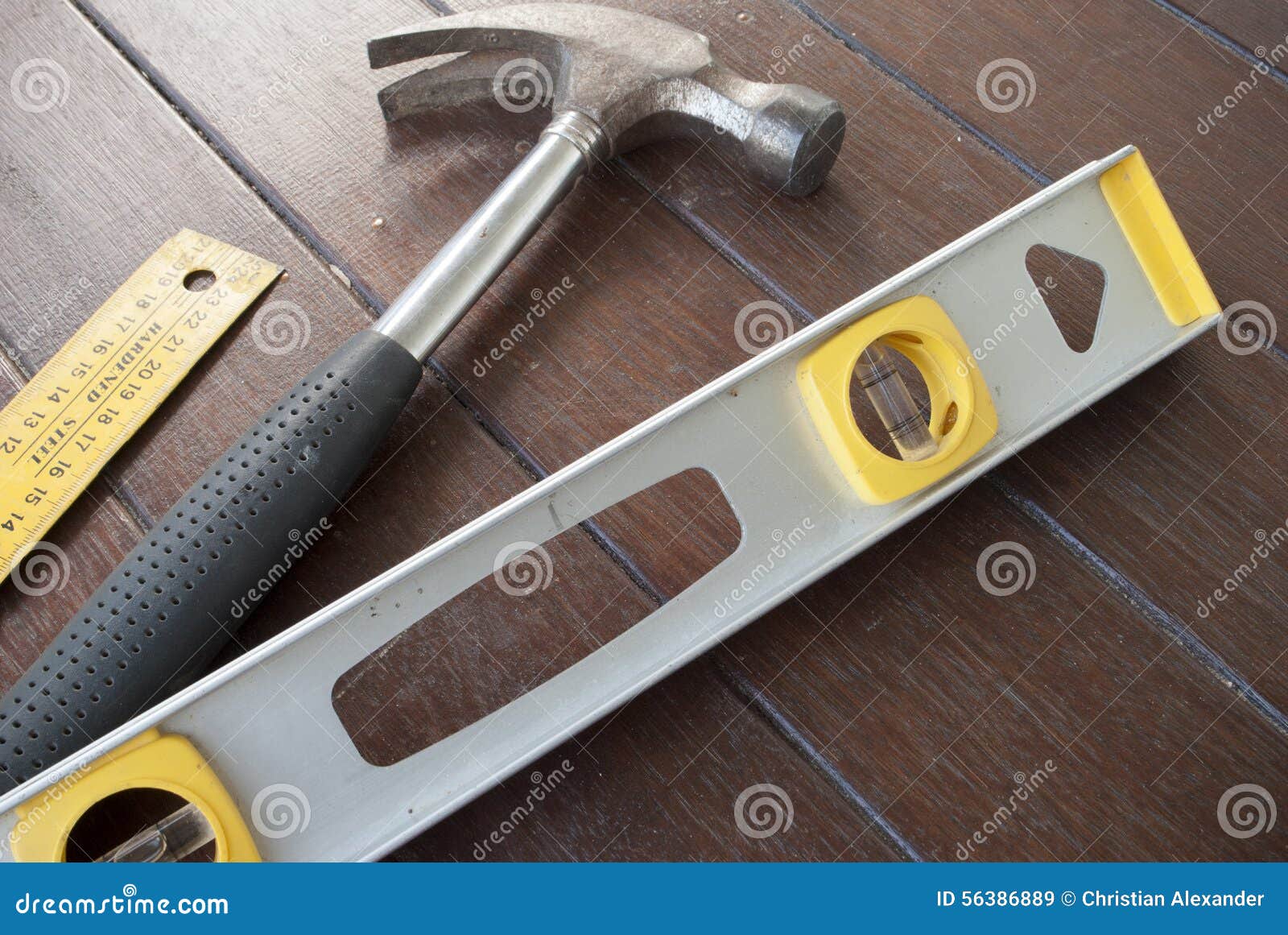 Hammer, Level and T Square Ruler on Timber Background Stock Image ...