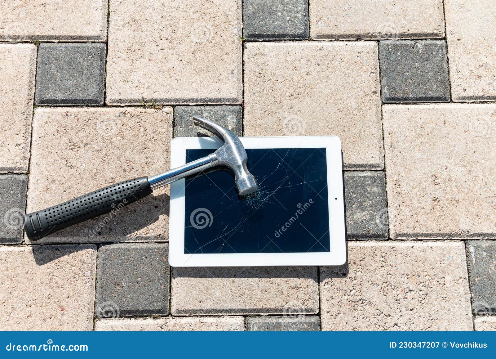 The Hammer Lies on the Broken Tablet Computer Screen. Stock Image ...