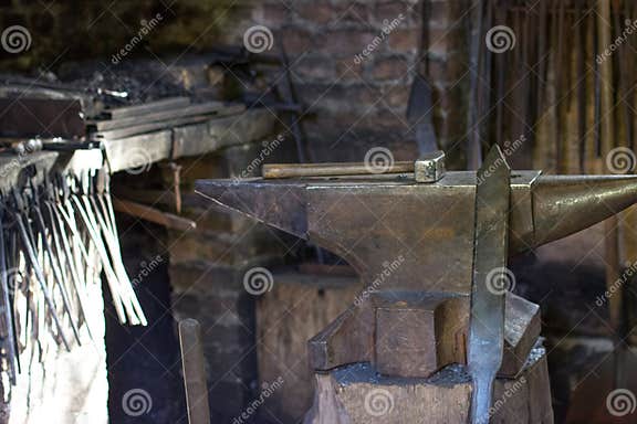 A Hammer and a Metal Object in the Forge Stock Image - Image of color ...