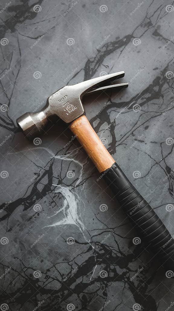 Hammer on Marbled Surface, Suggesting Durability and Functionality with ...