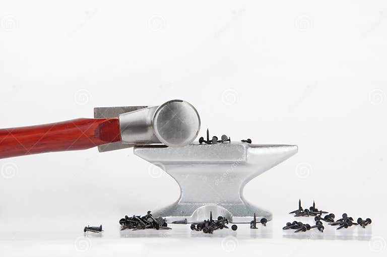 Hammer, nail and anvil stock image. Image of construction - 18312773