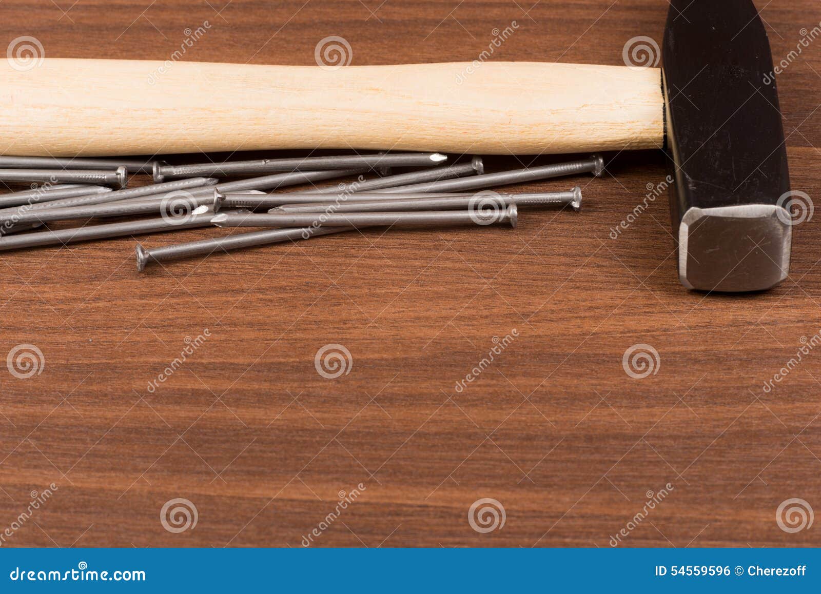 Hammer and nails on table stock photo. Image of iron - 54559596