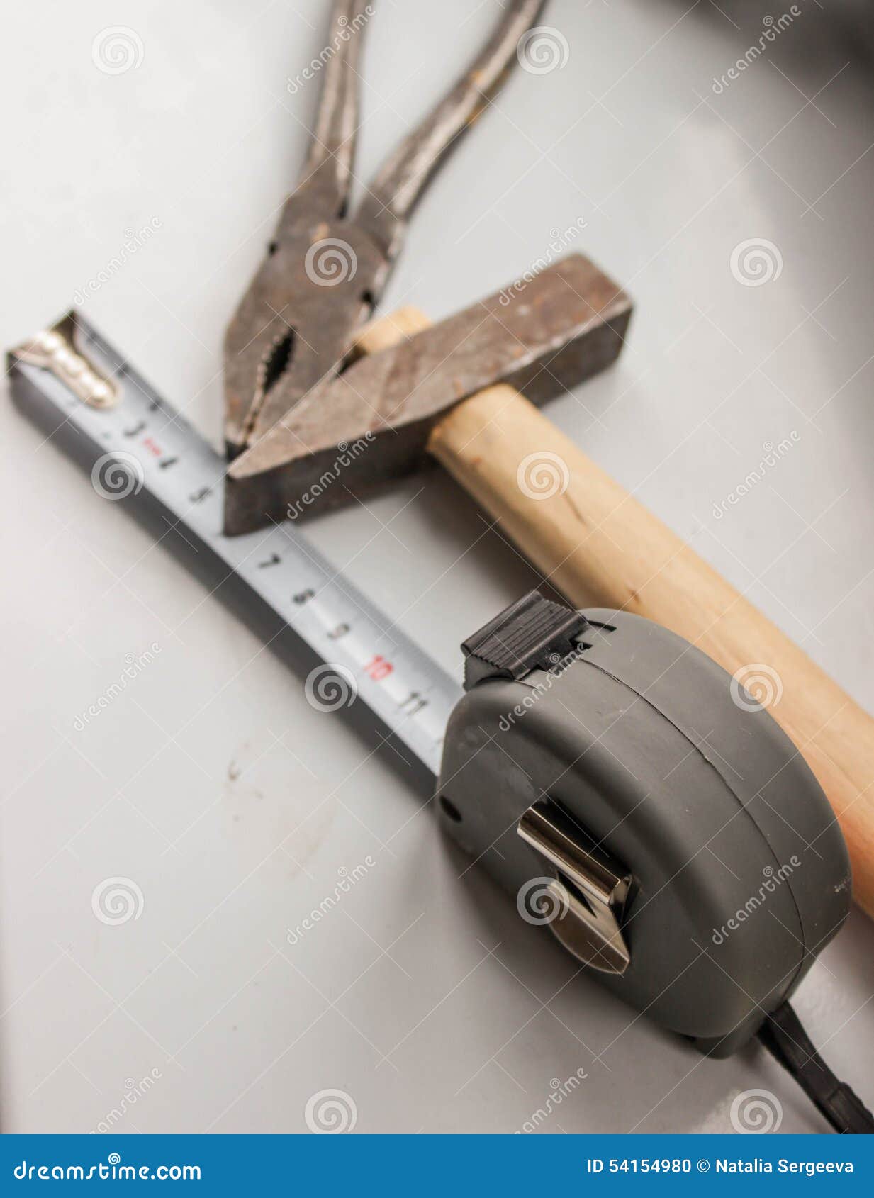 Hammer, Pliers and Measuring Tape Stock Photo - Image of tape, pliers ...