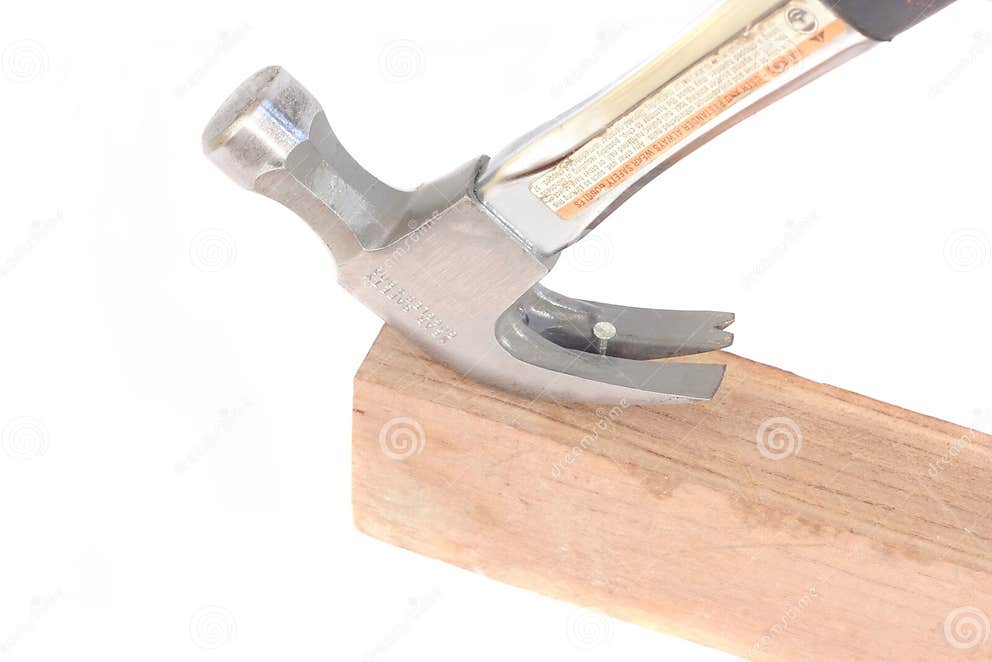 Hammer pulling out a nail stock photo. Image of nail, making - 2369962