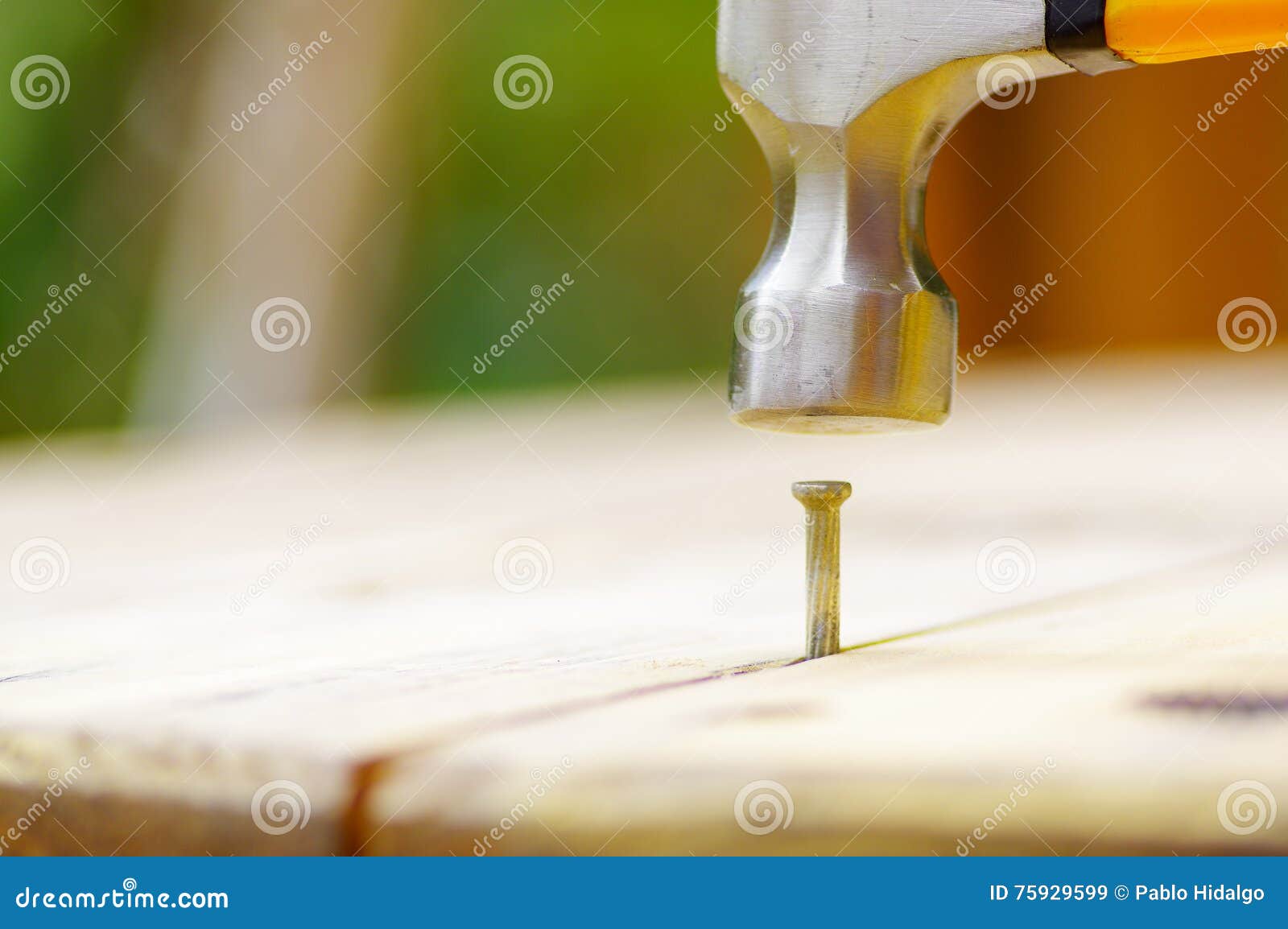 Hammer Smashing a Nail in a Piece of Wood Stock Image - Image of ...