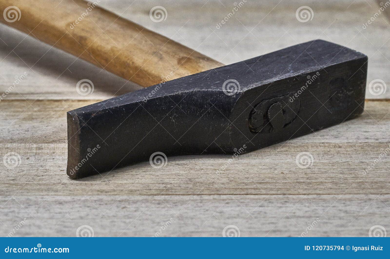 Hammer on a wooden table stock photo. Image of shot - 120735794
