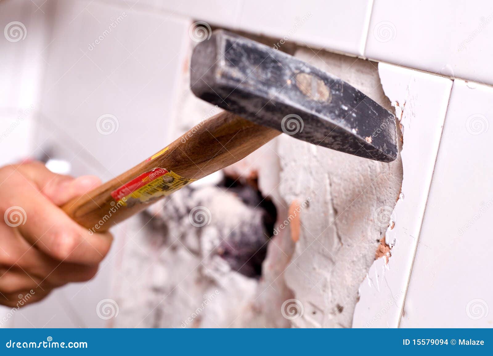 Hammering Away on Wall Tiles Stock Photo - Image of tiles, hands: 15579094