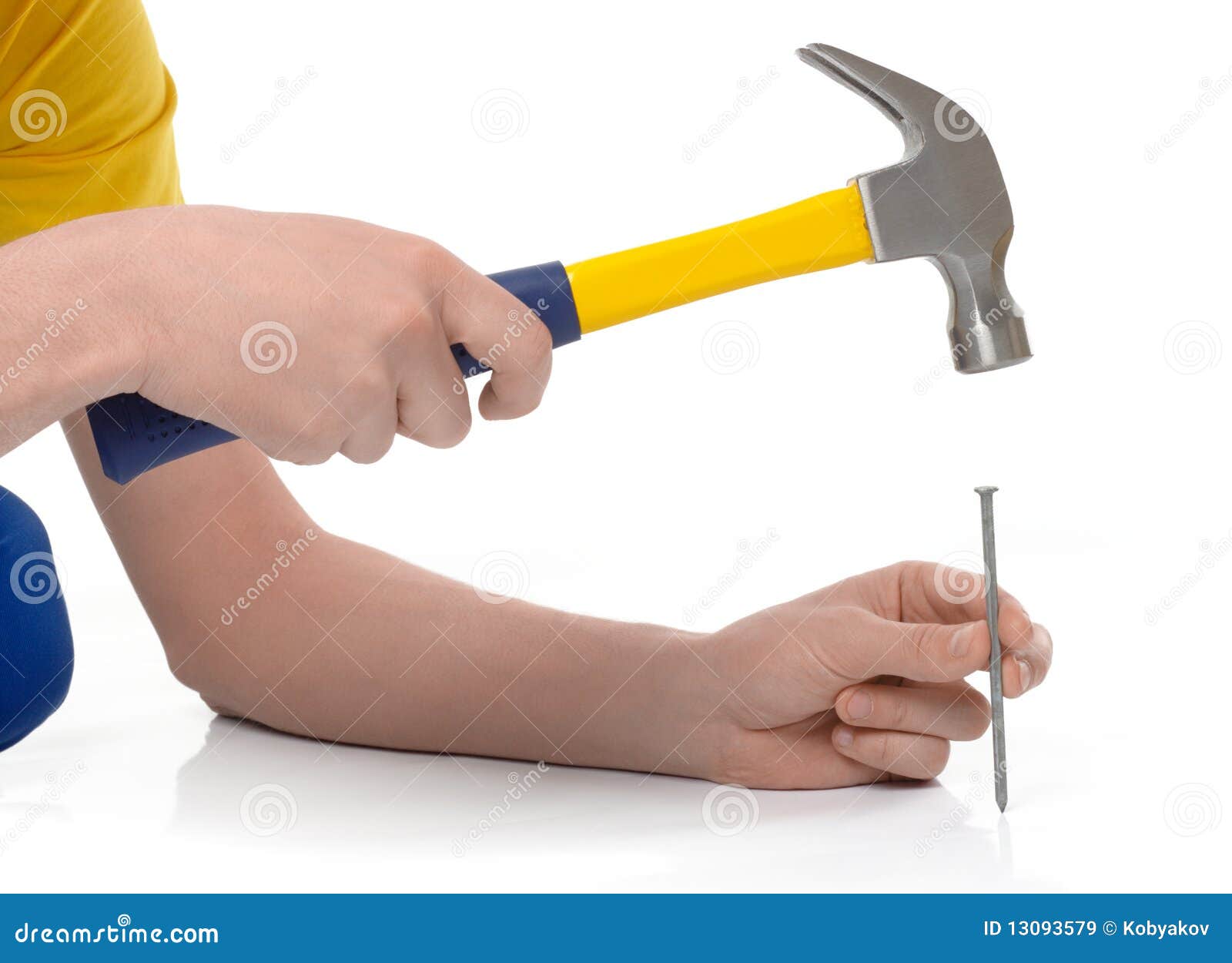 Hammering a nail stock image. Image of hammer, helmet - 13093579