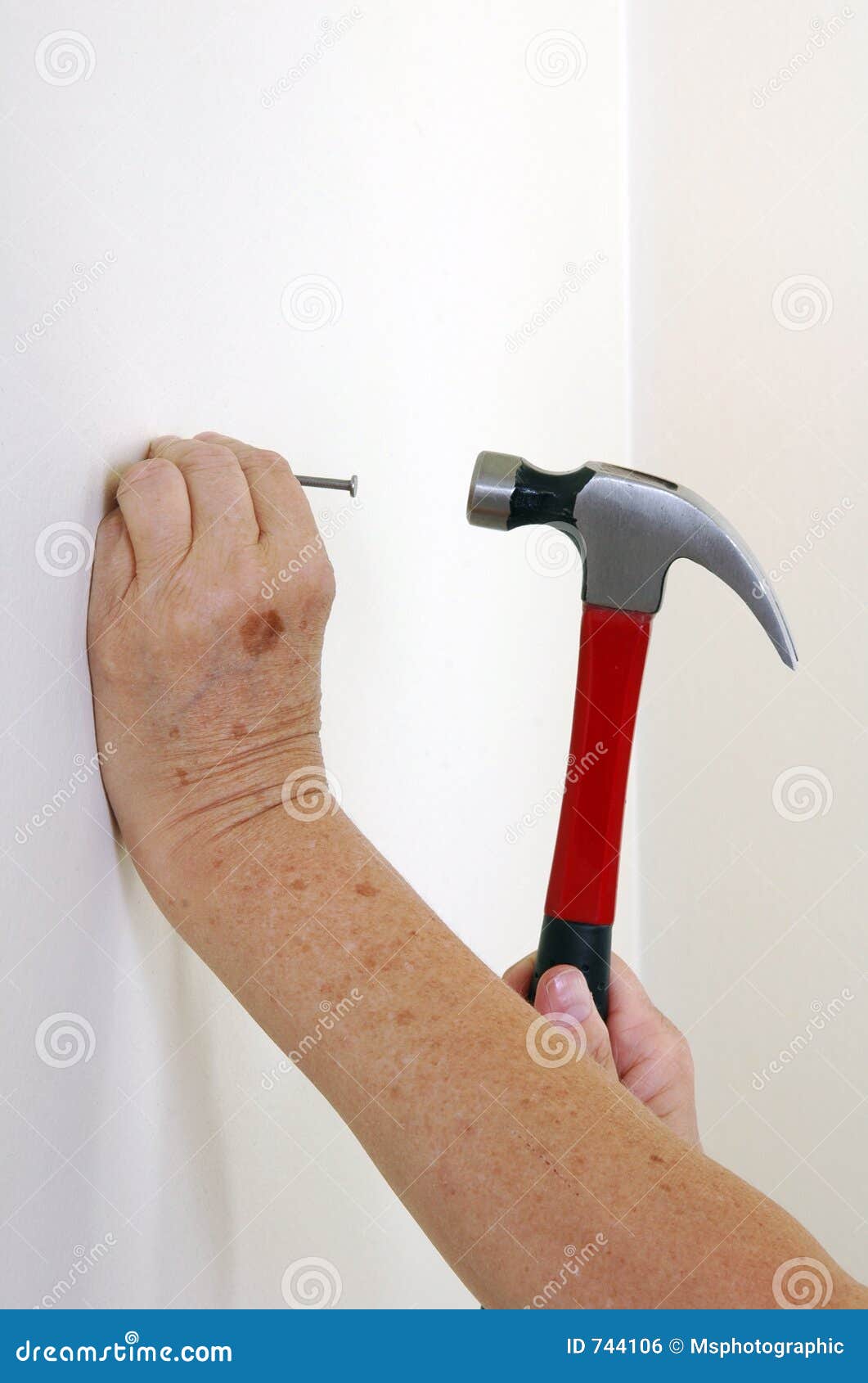 Hammering a nail stock photo. Image of hand, improvement - 744106