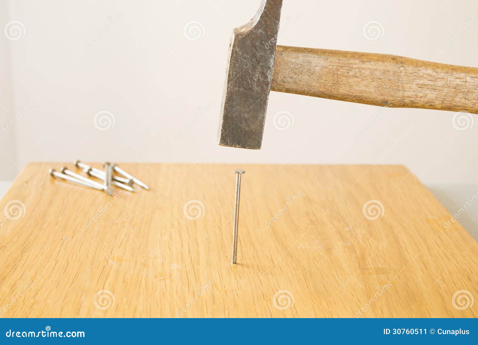 Hammering a Nail into a Board Stock Image - Image of close, motion ...