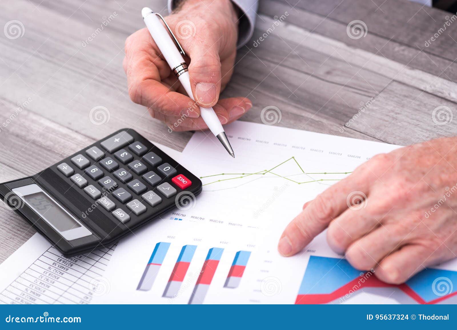 Hand of an Accountant Working on Financial Documents Stock Photo ...