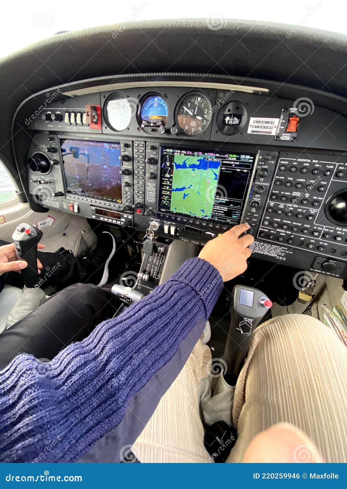 A Hand Acting on the Control Panel in the Cockpit of an Airplane Stock ...