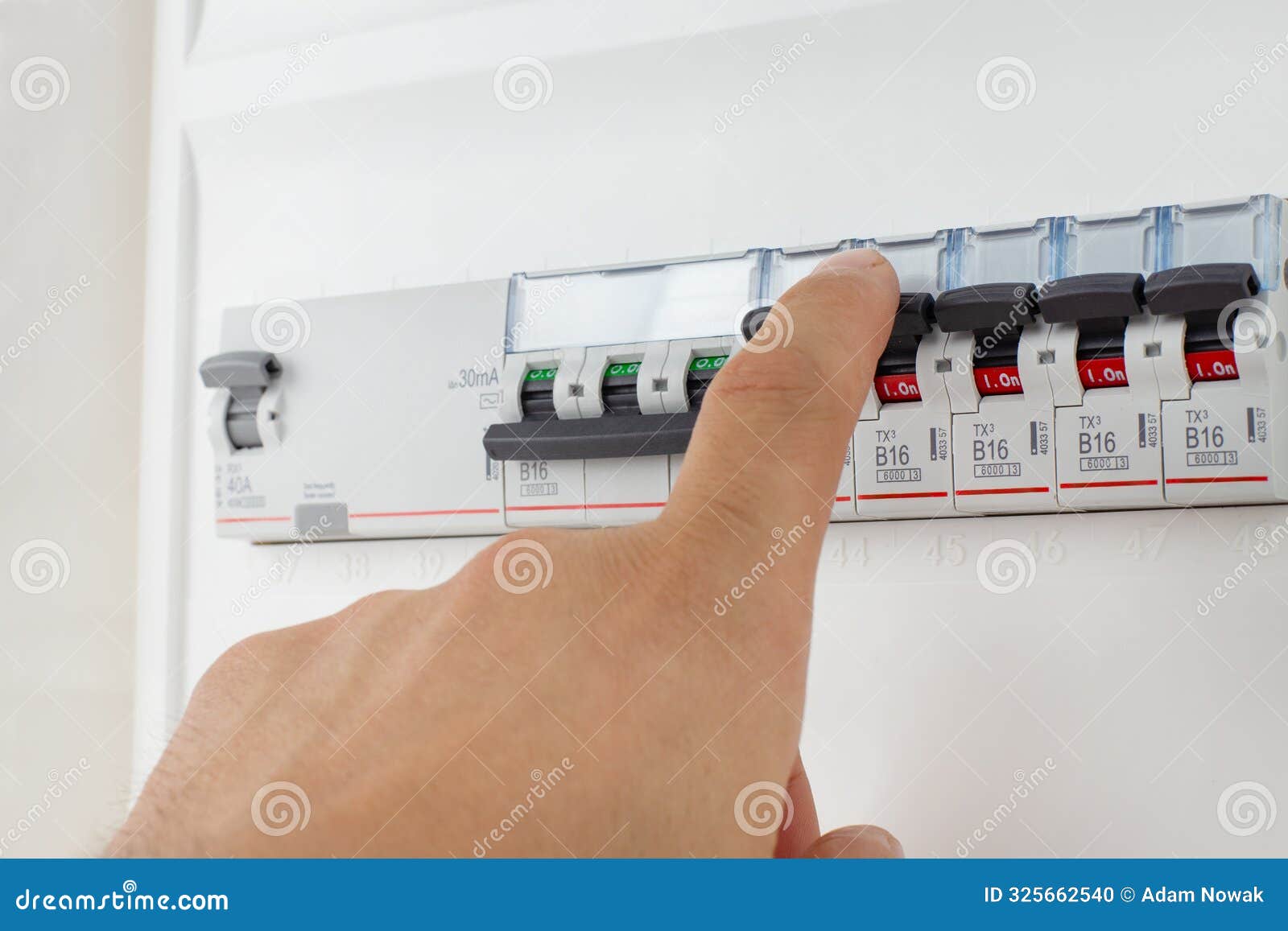 Hand Adjusting Circuit Breakers on Panel Stock Photo - Image of ...