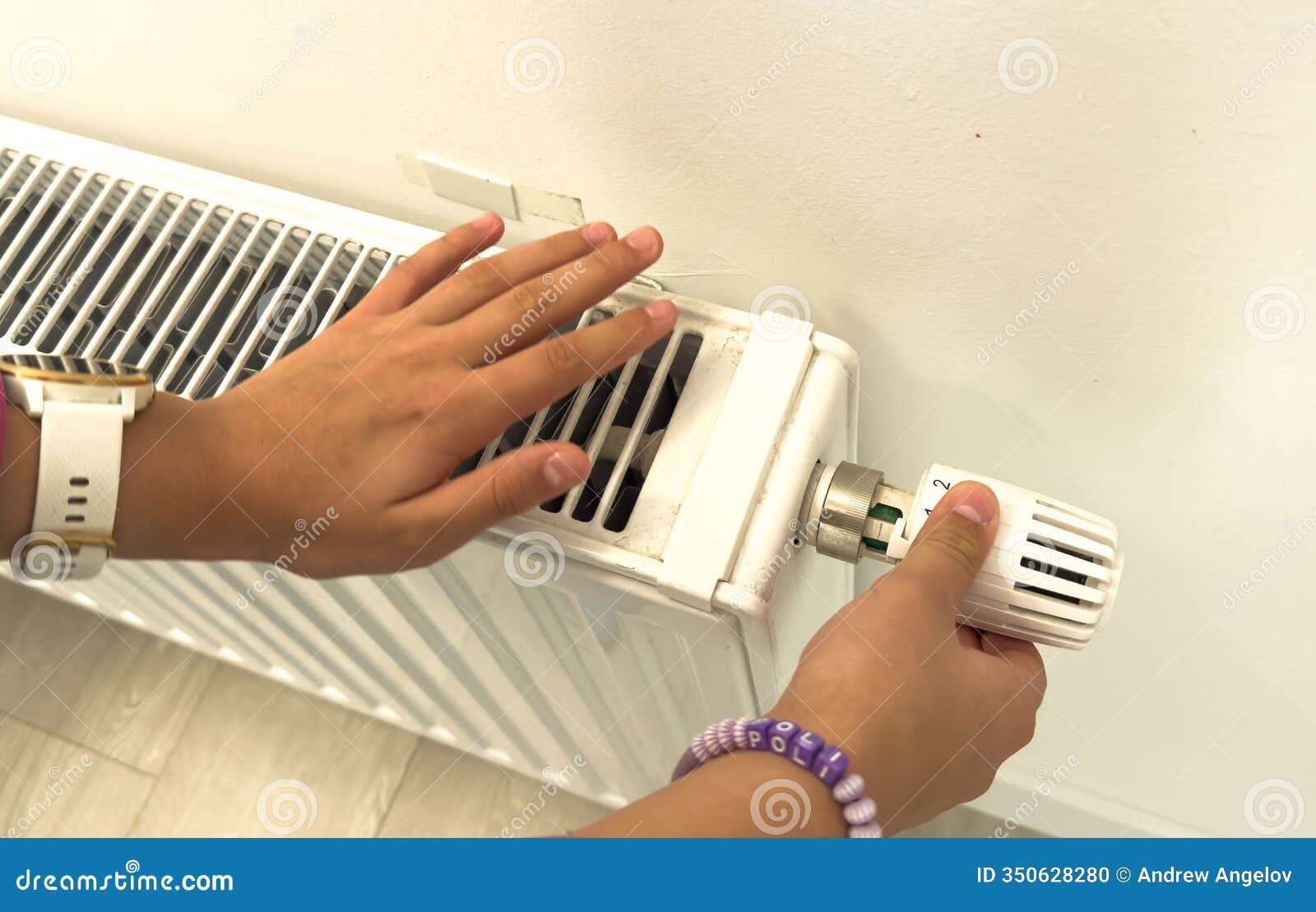 Hand Adjusting Radiator Temperature Using Thermostat. Home with Central ...