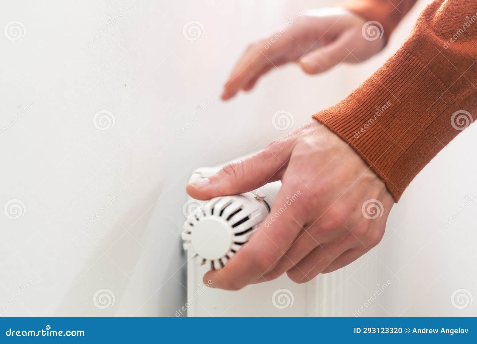 Hand Adjusting Radiator Temperature Using Thermostat. Home with Central ...