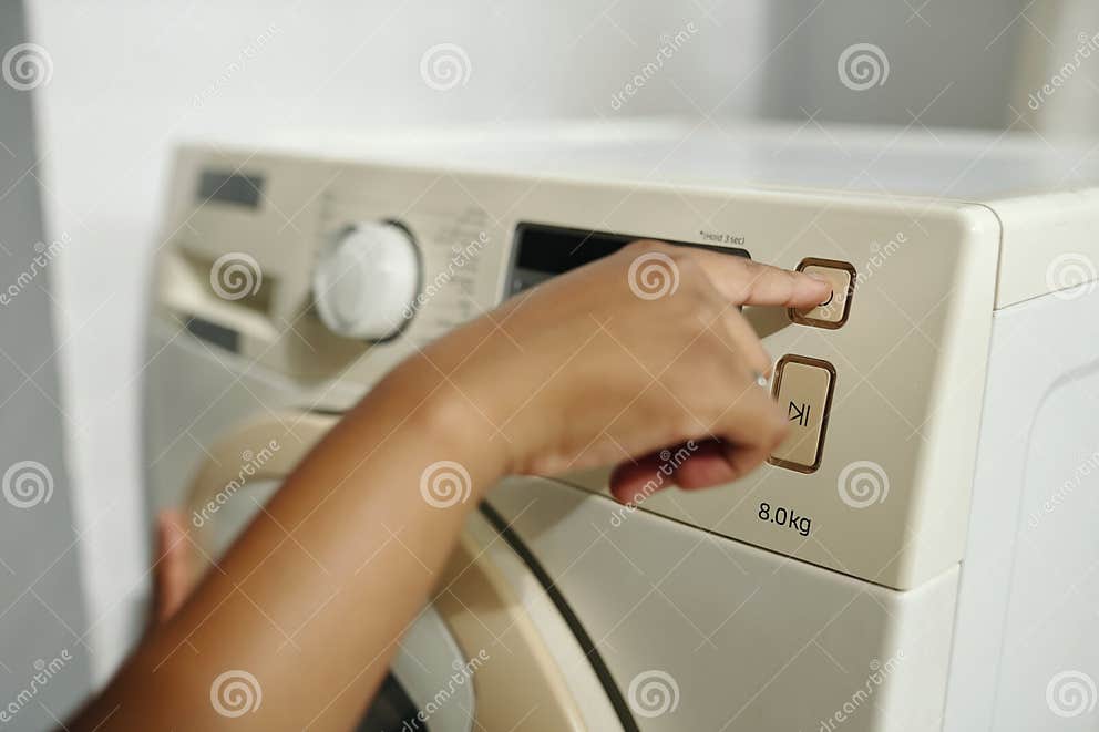 Adjusting Settings on Modern Washing Machine Stock Photo - Image of ...