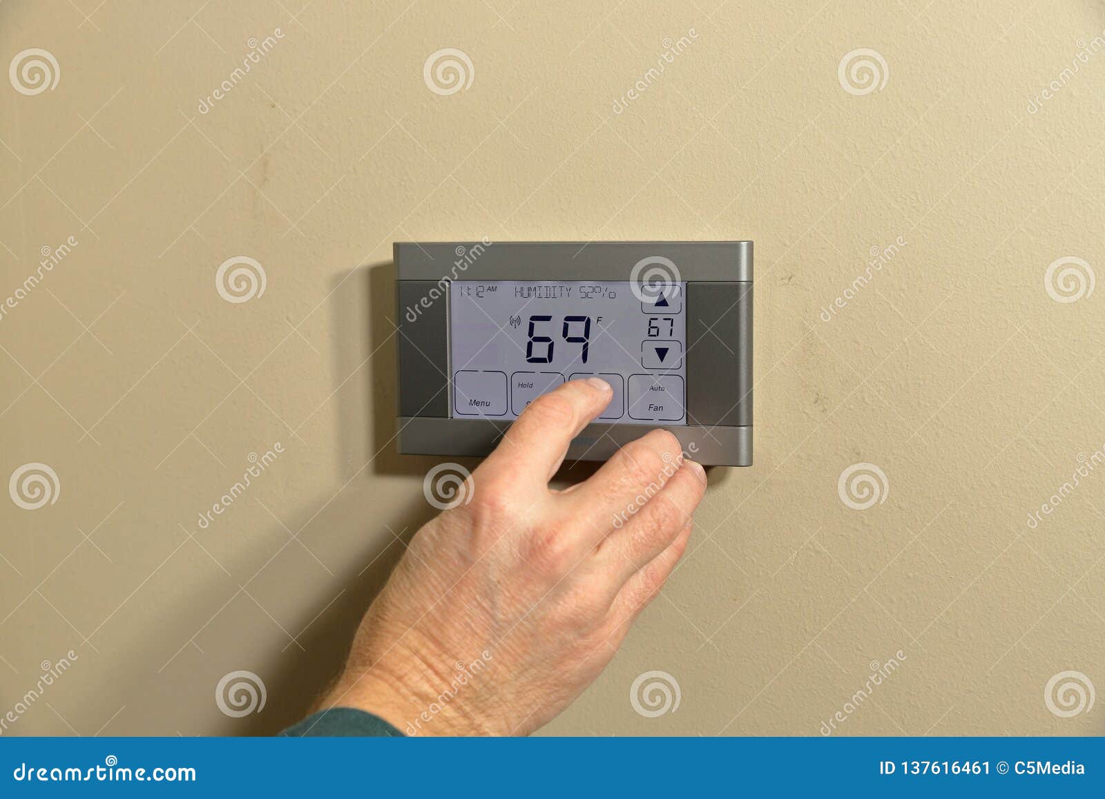 Hand Adjusting Temperature on Thermostat Stock Image - Image of ...