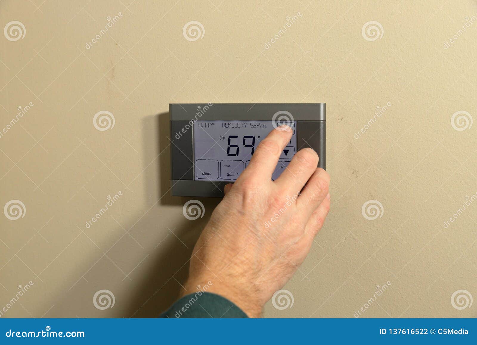 Hand Adjusting Temperature on Thermostat Stock Photo - Image of finance ...