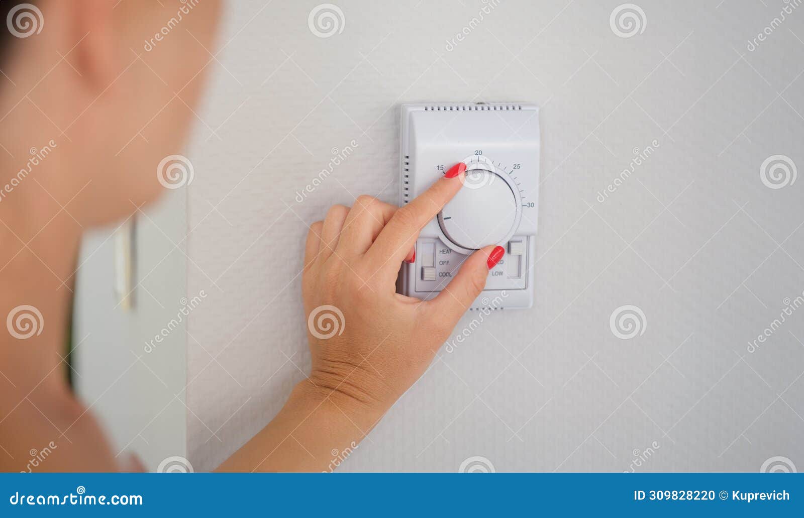 Hand Adjusts Button of the Control Unit of Heating and Cooling System ...