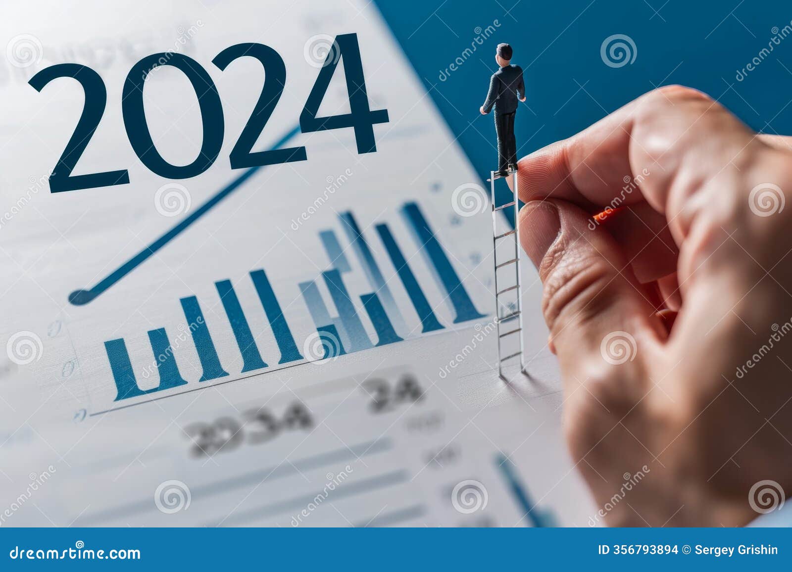 A Hand Adjusts a Miniature Figure Standing on a Ladder Next To Growth ...